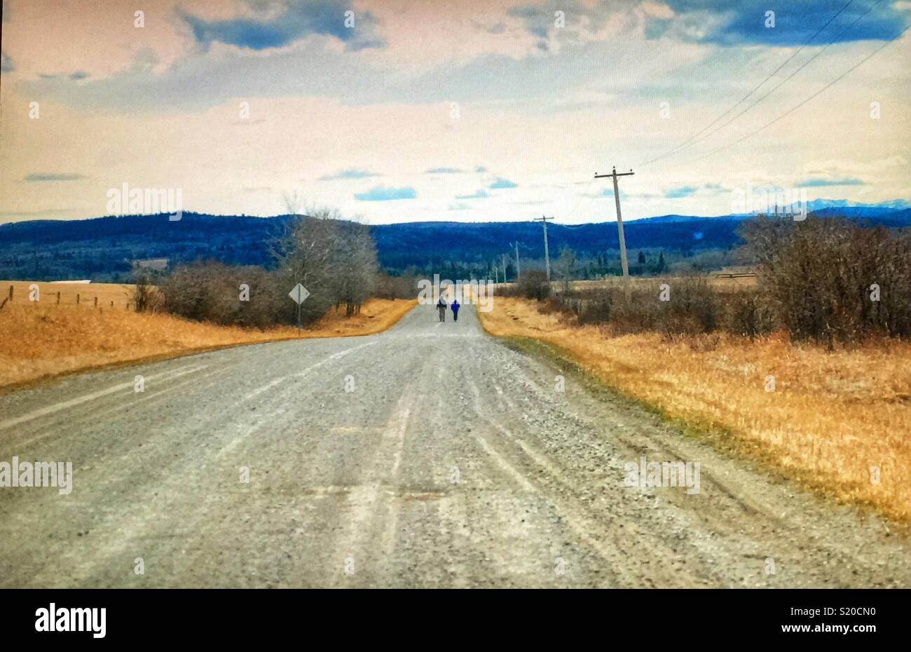 Two people walking Stock Photo - Alamy