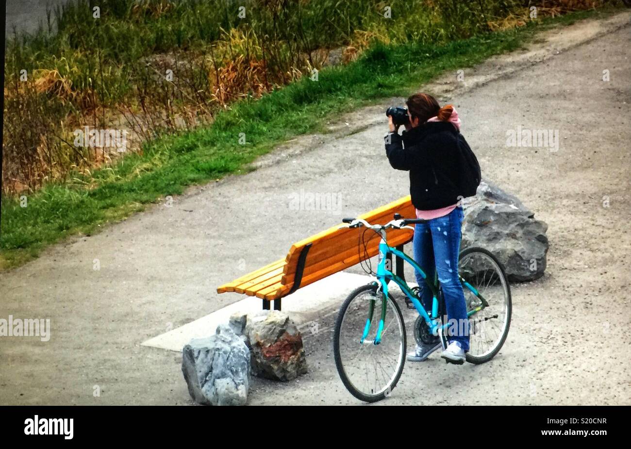 Photographer on a bicycle Stock Photo - Alamy