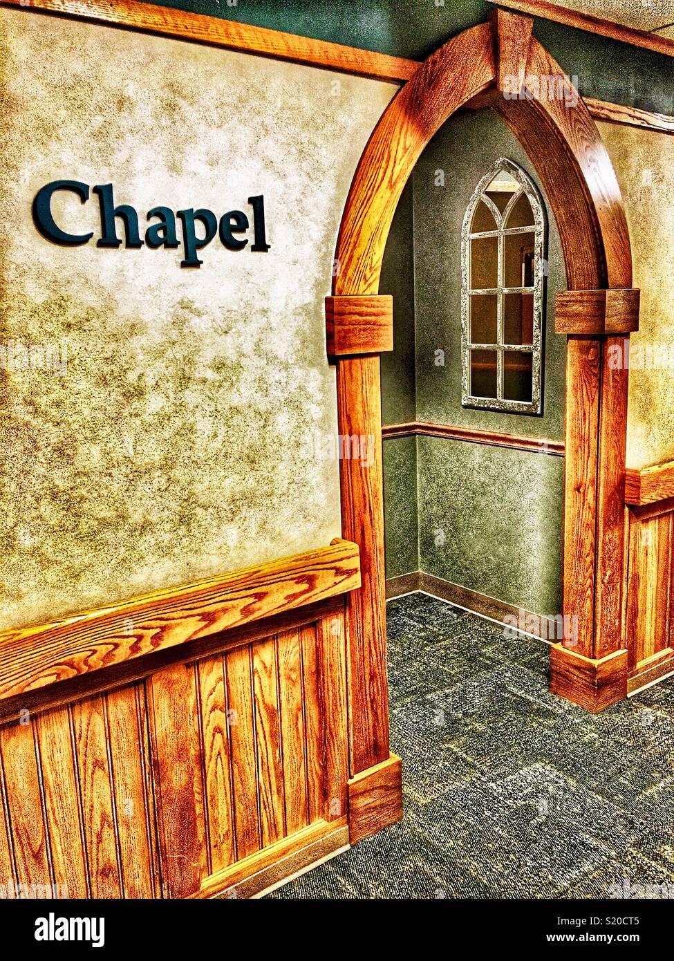 Hospital chapel entrance with gothic entryway and mirror Stock Photo ...