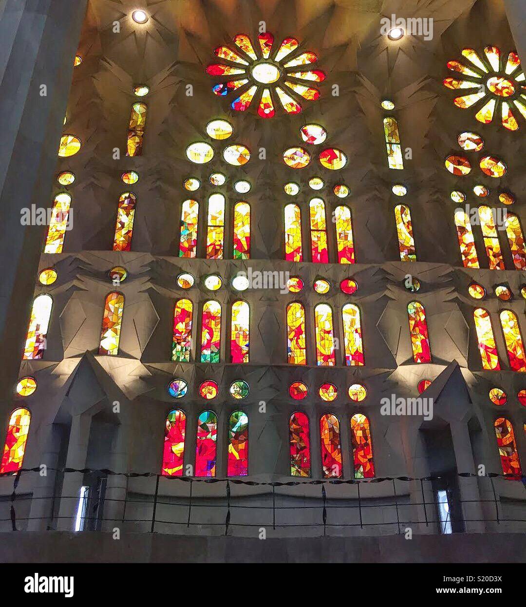 Sun shining through stained glass windows at La Sagrada Familia in ...