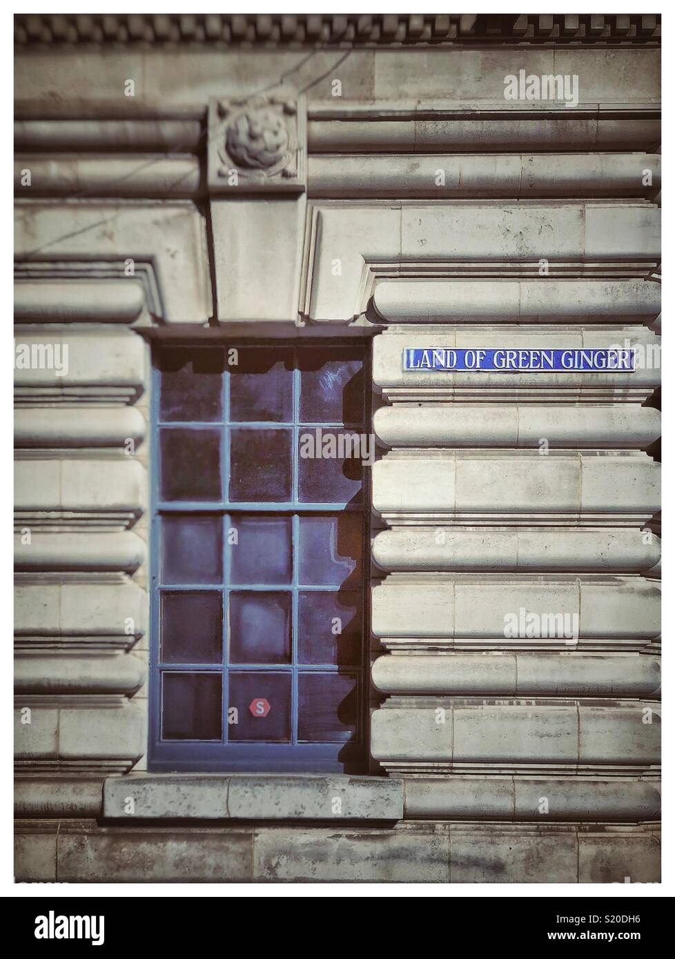 The Land of Green Ginger - street sign on building alongside window ...