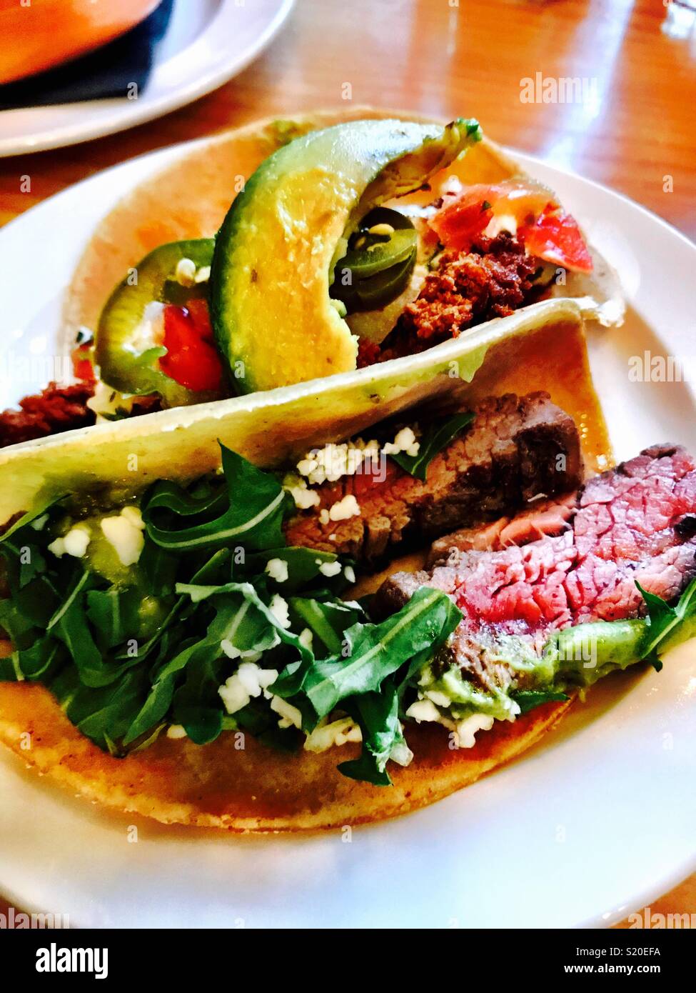 A carne asada street taco sits cooling on a plate Stock Photo - Alamy