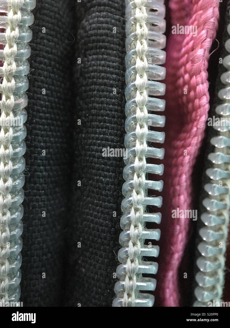 Vertical zipper compartments on purse macro Stock Photo - Alamy