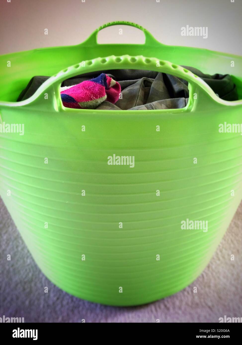 Dirty clothes in bucket hi-res stock photography and images - Alamy