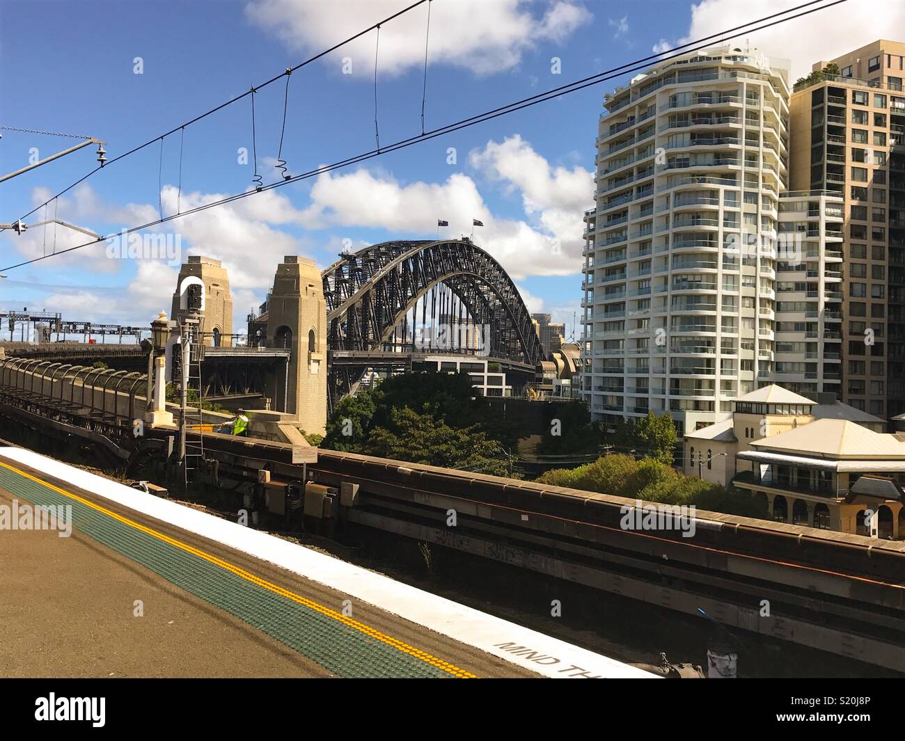 A view of the Sydney Harbour Bridge from Milsons Point train station ...