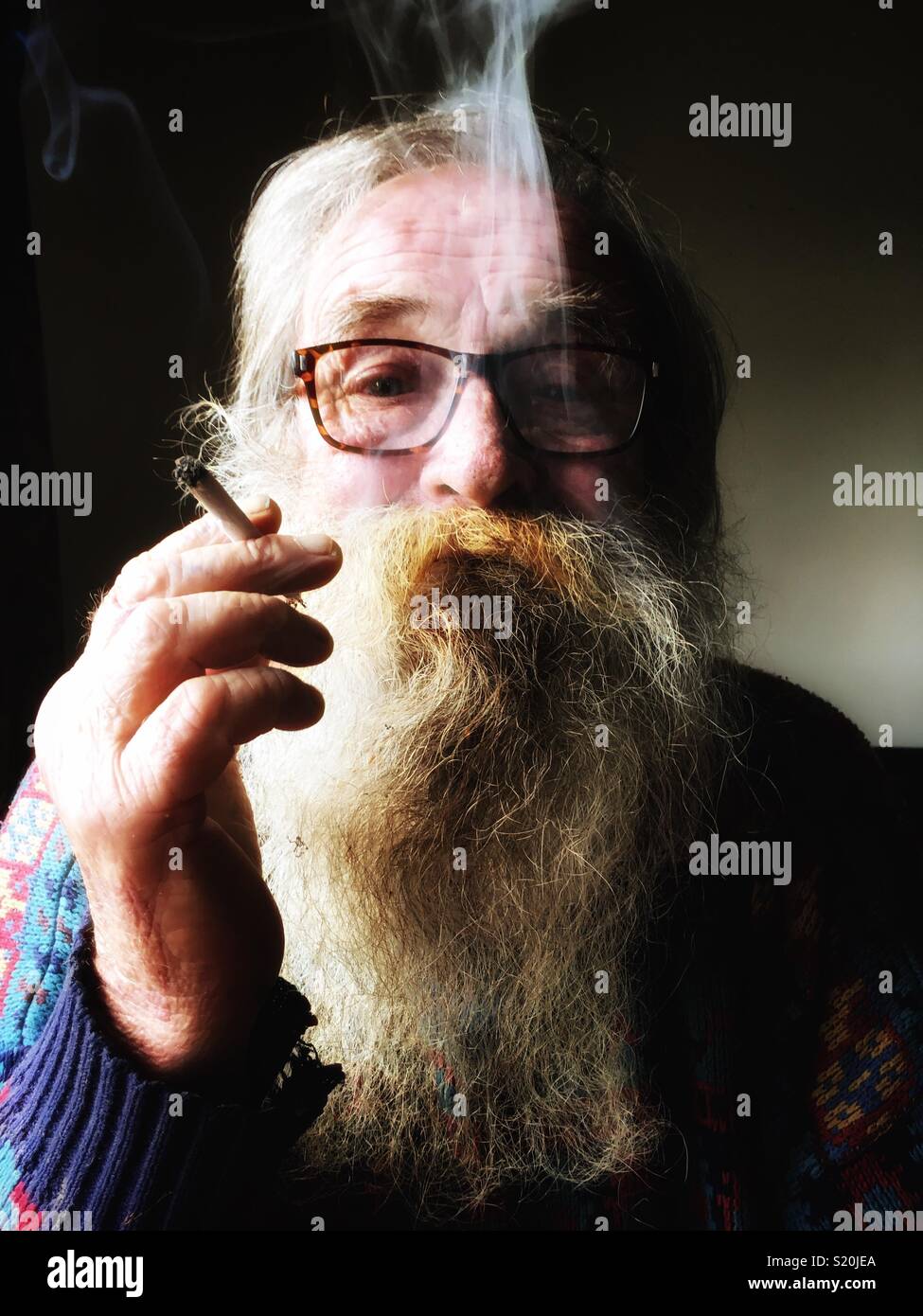 Old age pensioner smoking cigarette hi-res stock photography and images ...