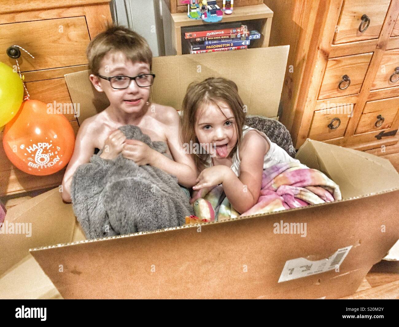 Children playing with boxes hi-res stock photography and images - Alamy