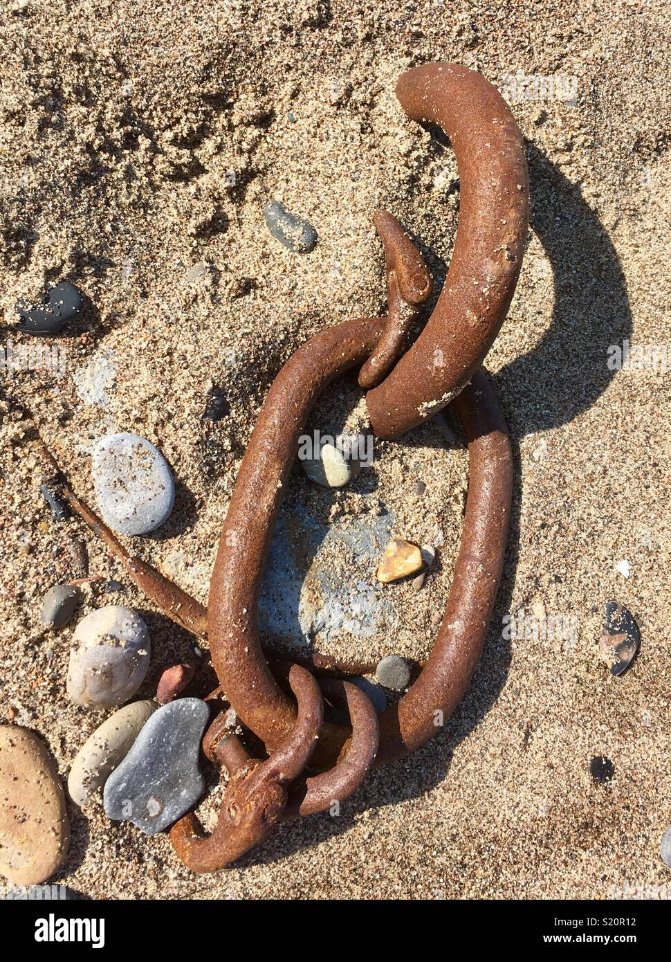 Rusty chain on beach Stock Photo - Alamy