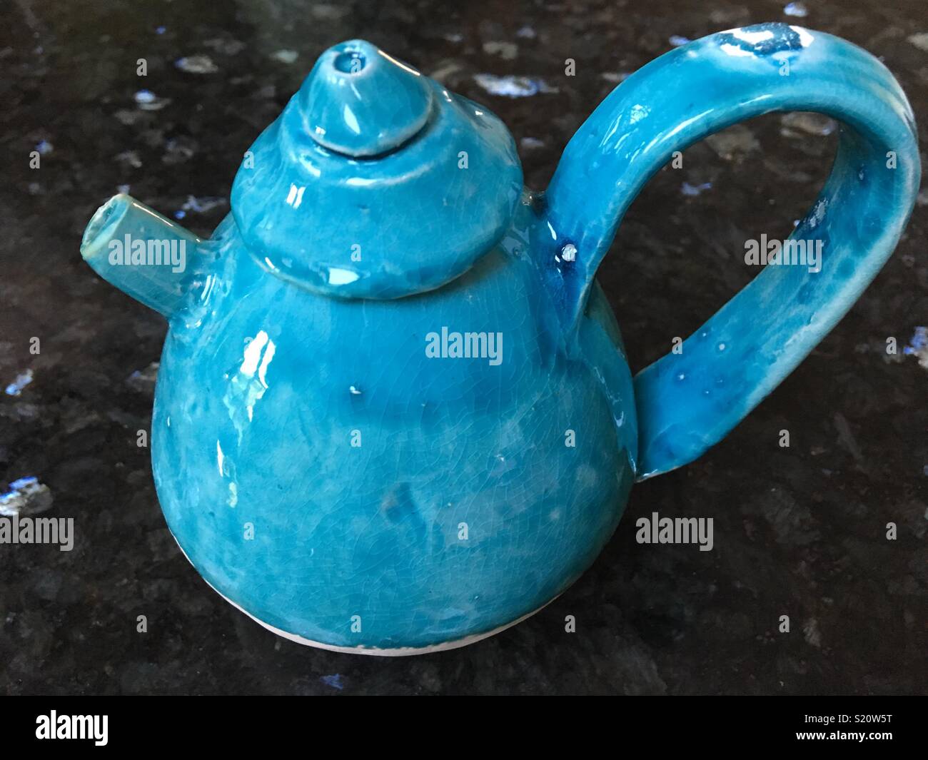 Blue pinch teapot Stock Photo - Alamy