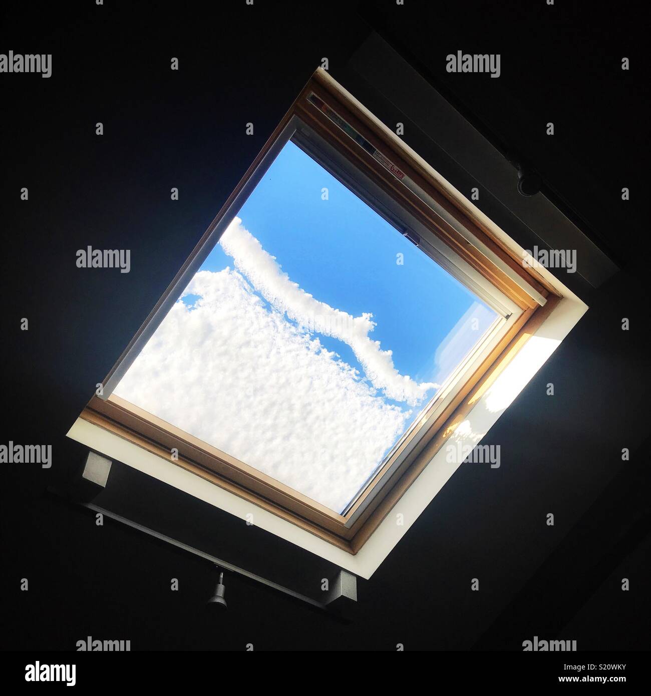 Snow settling on skylight window Stock Photo - Alamy