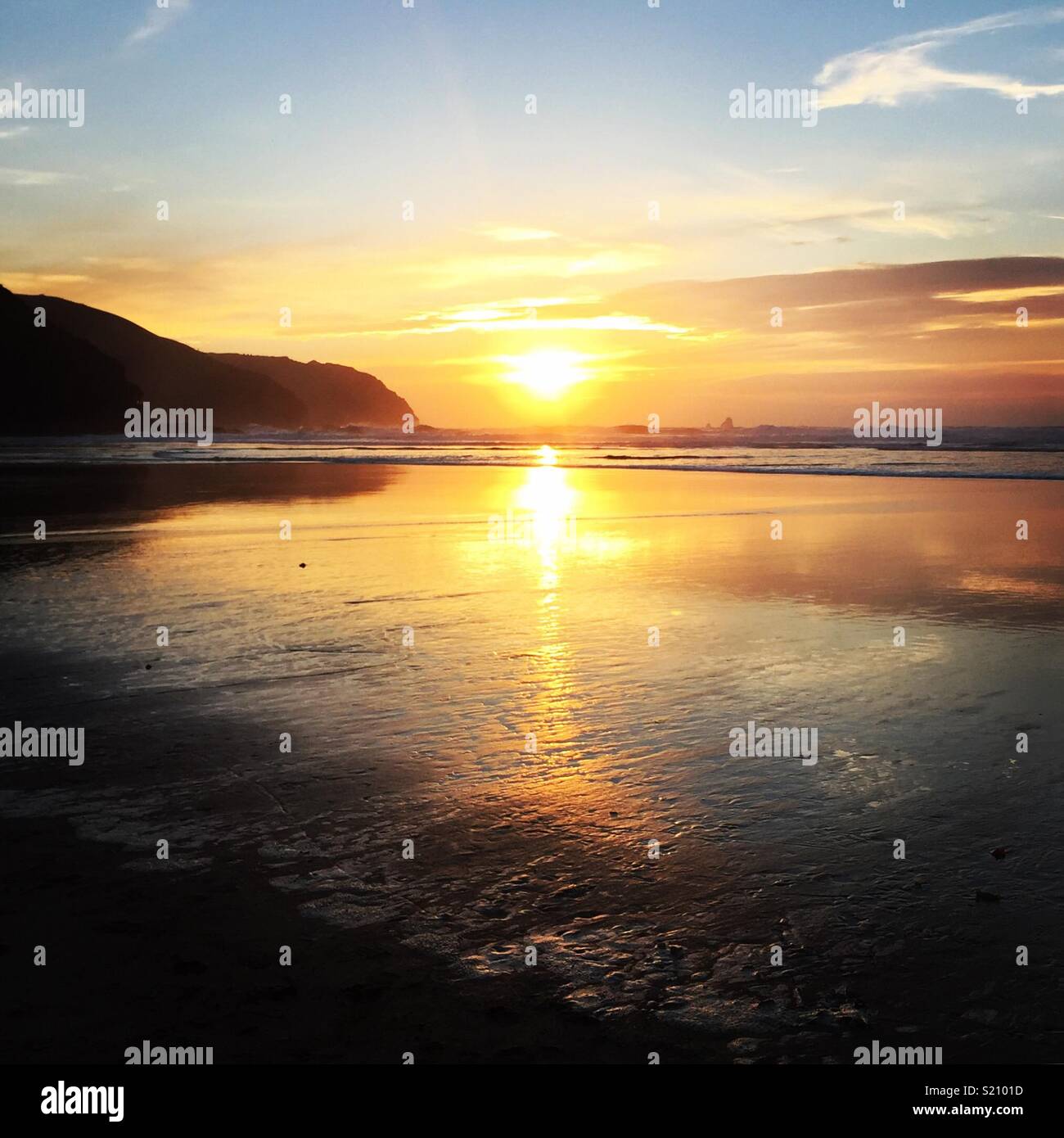 Sunset at a beach in Cornwall Stock Photo - Alamy