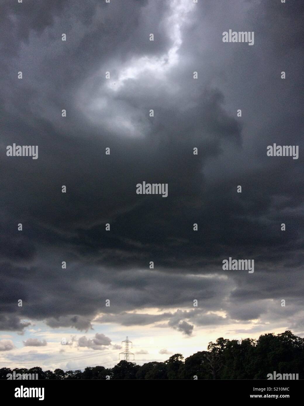 Storm above electricity pylon Stock Photo - Alamy