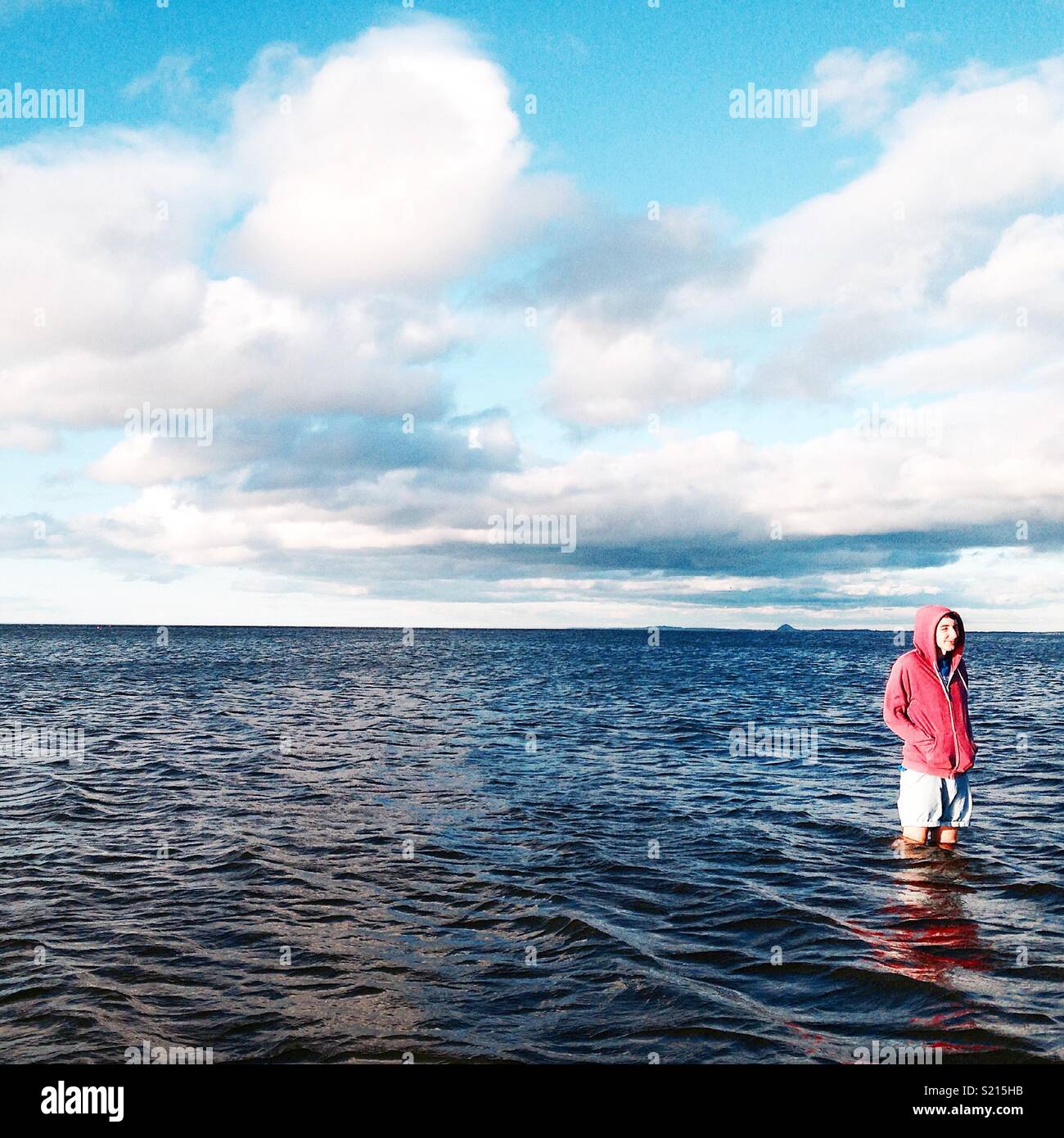 Standing in the sea Stock Photo - Alamy