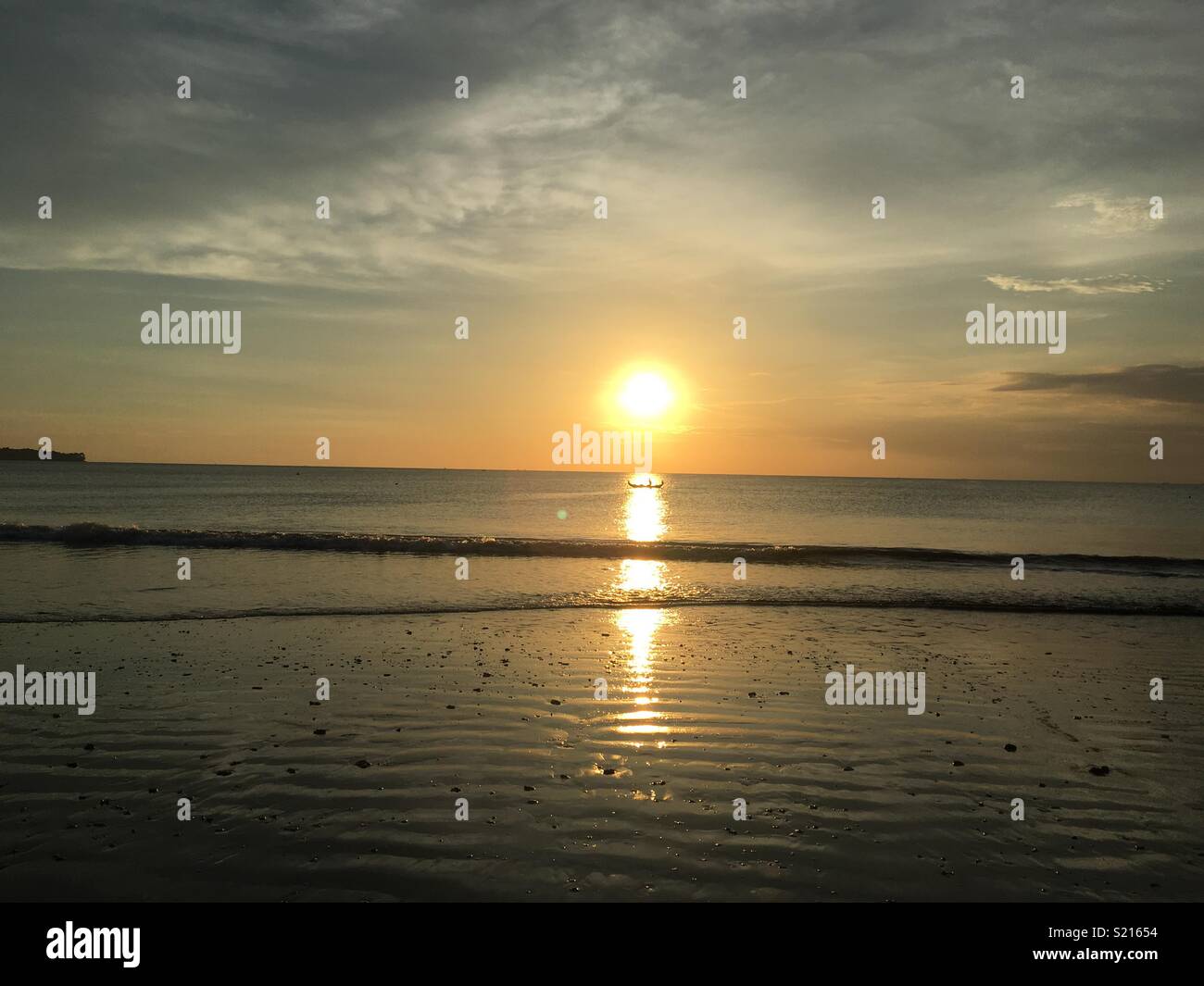 Sunset on Jimbaran Bay, Bali Stock Photo - Alamy