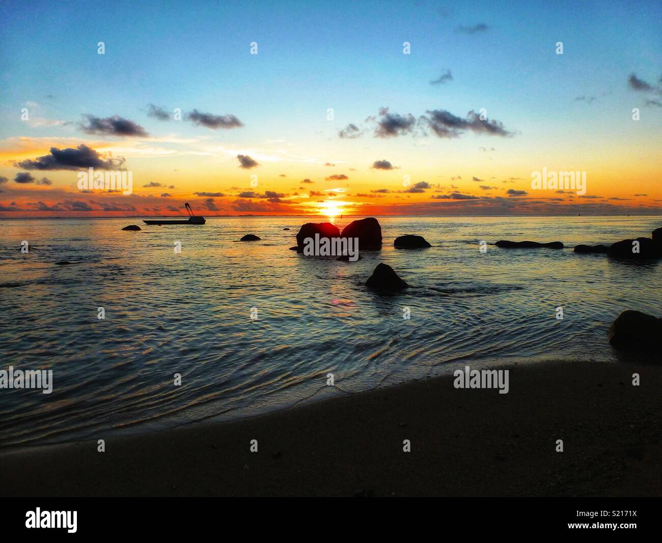 Sunset with speed boat Stock Photo - Alamy