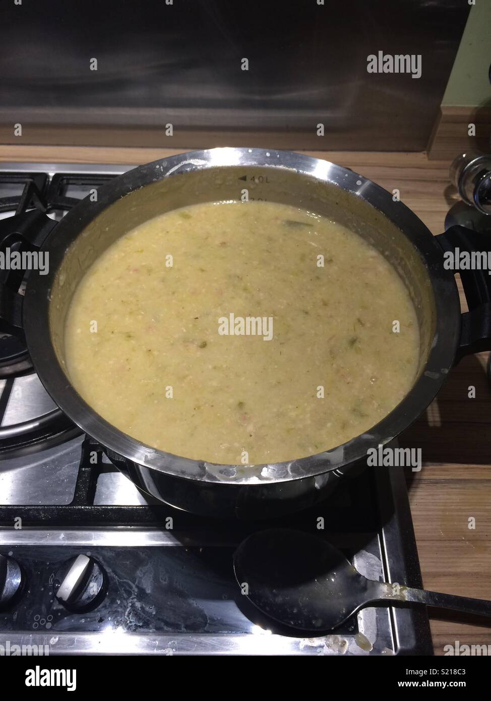 Soup cooking in a pot on stove Stock Photo - Alamy