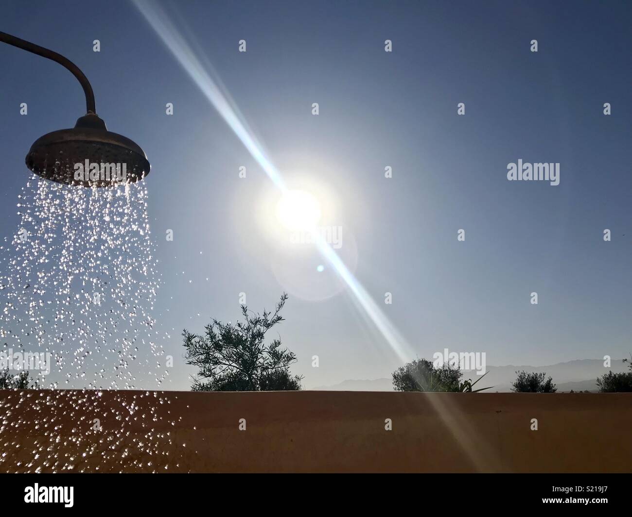 Sun shower hi-res stock photography and images - Alamy