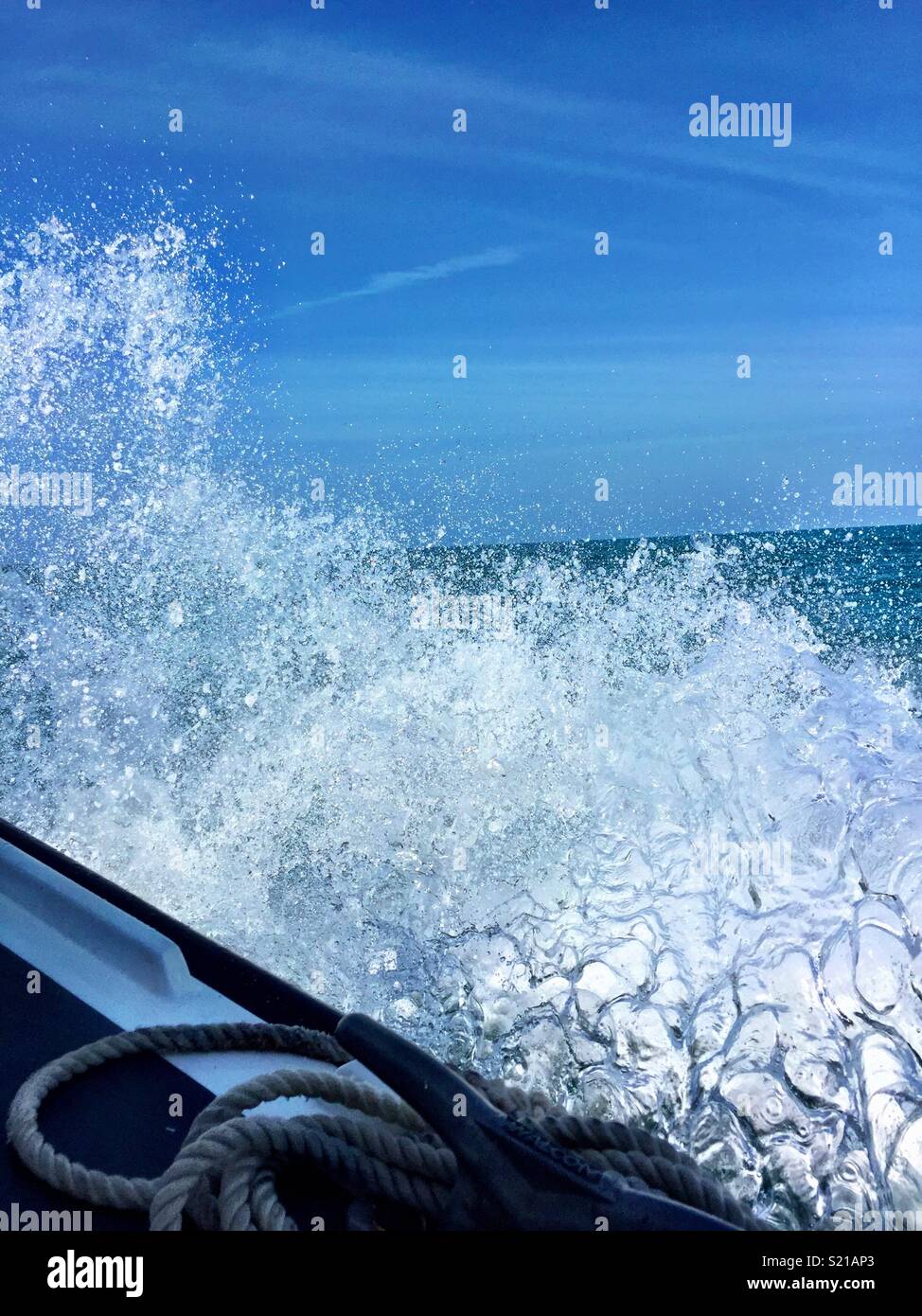 Water splashing against a boat in the Ocean Stock Photo - Alamy
