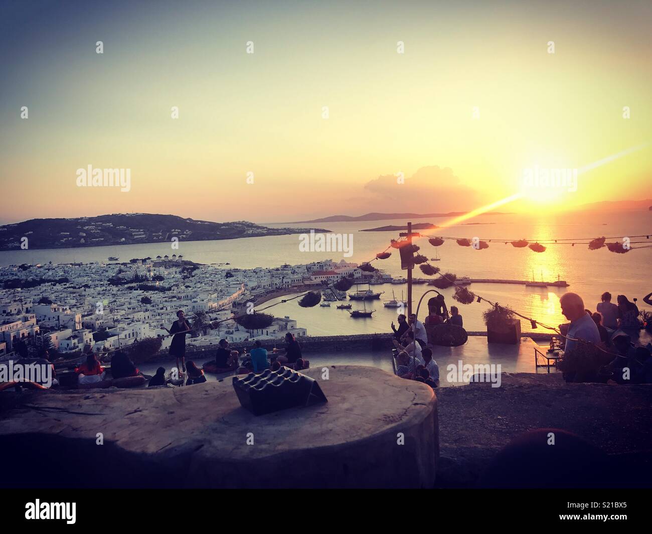 Mykonos sunset bar Stock Photo - Alamy