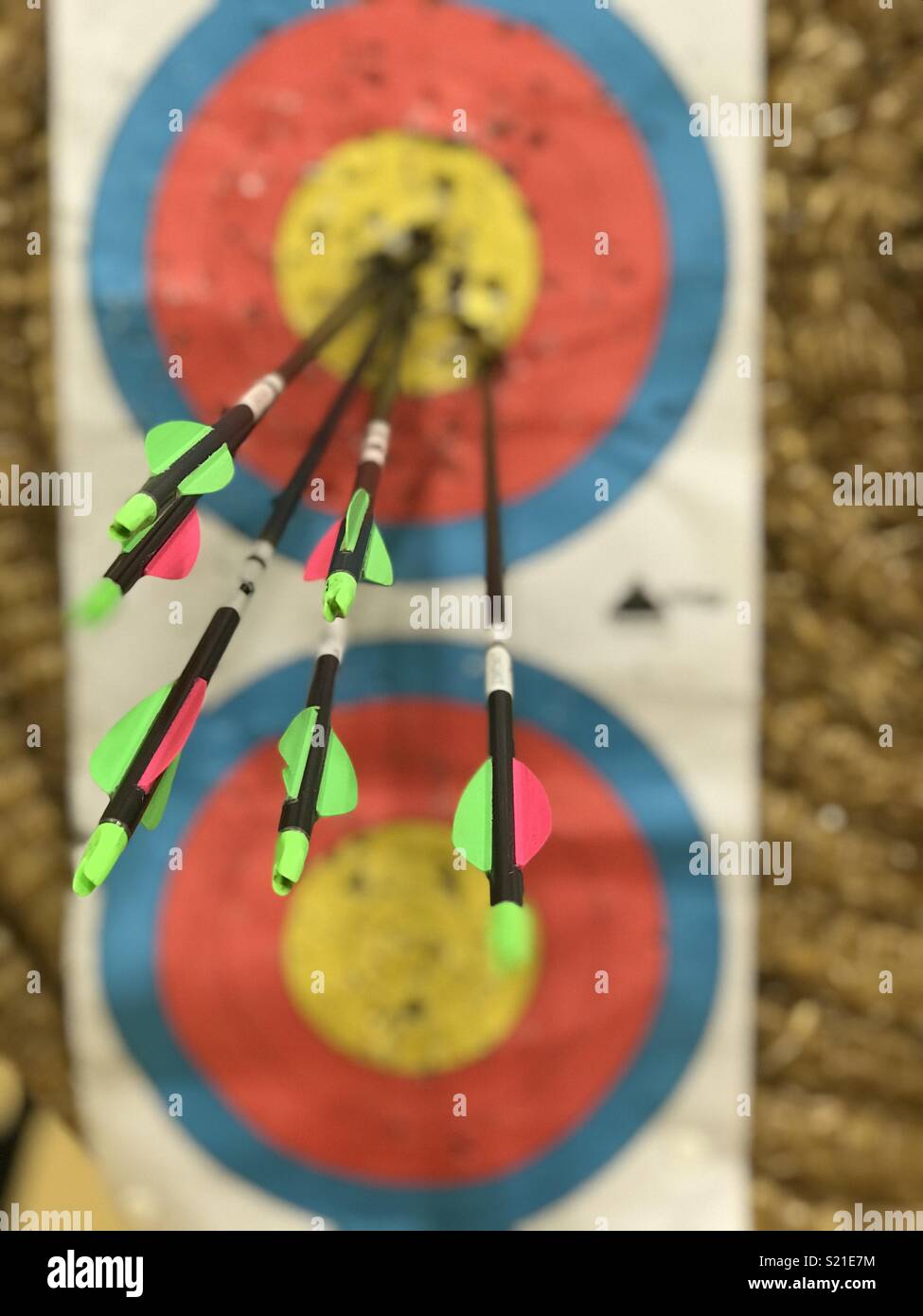 Archery arrows in target Stock Photo - Alamy