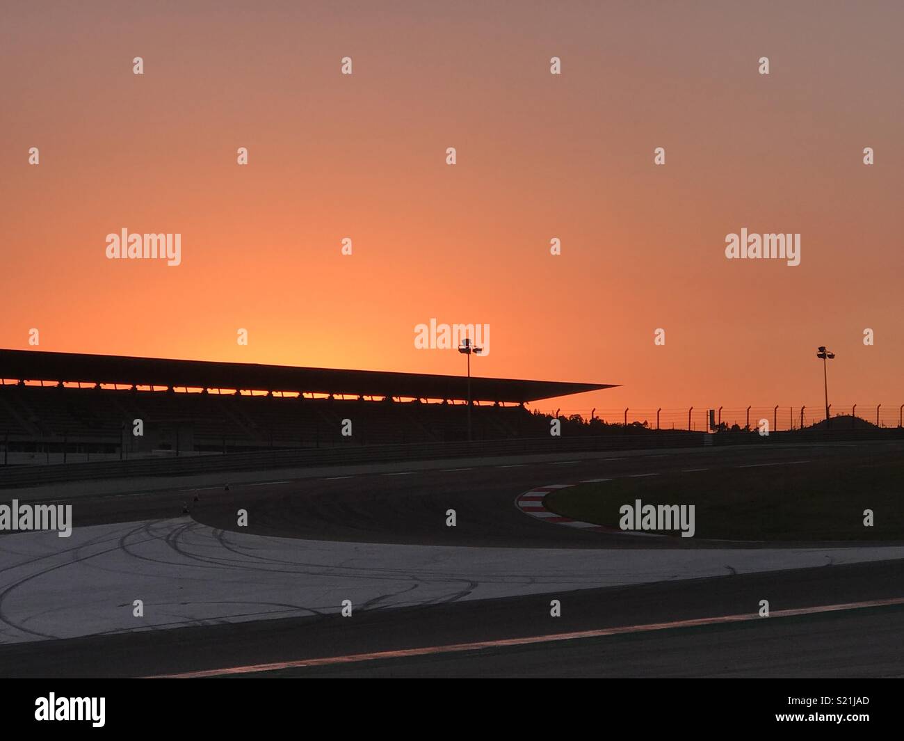 Race track at sunset Stock Photo - Alamy