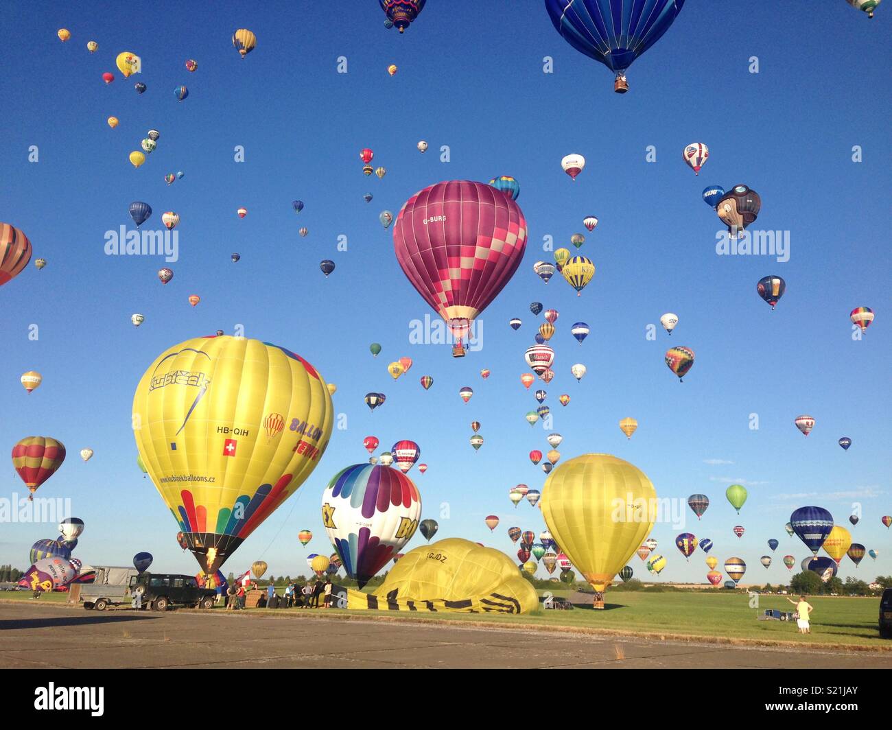 Balloons taking off Stock Photo - Alamy