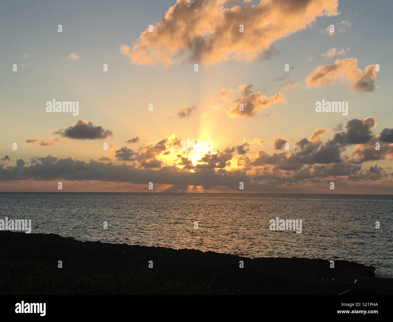 Sunset in Grand Cayman Stock Photo - Alamy