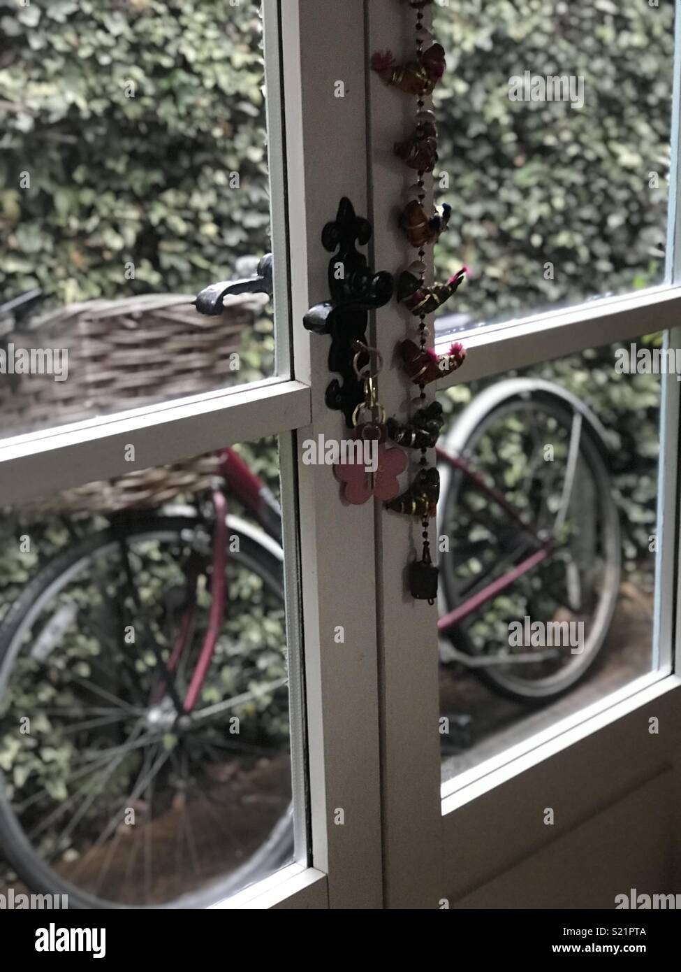 Bicycle through the window Stock Photo - Alamy