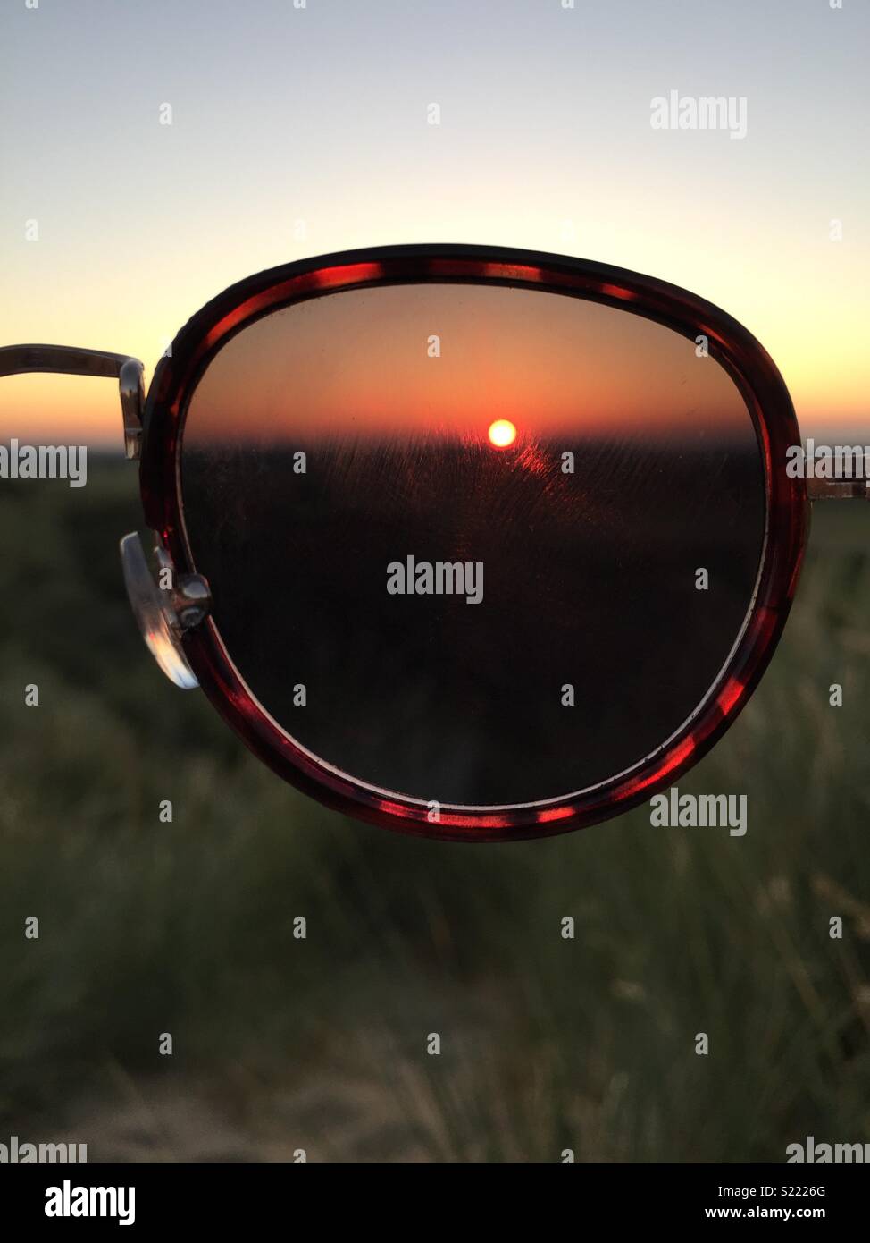Sunset through glass Stock Photo - Alamy