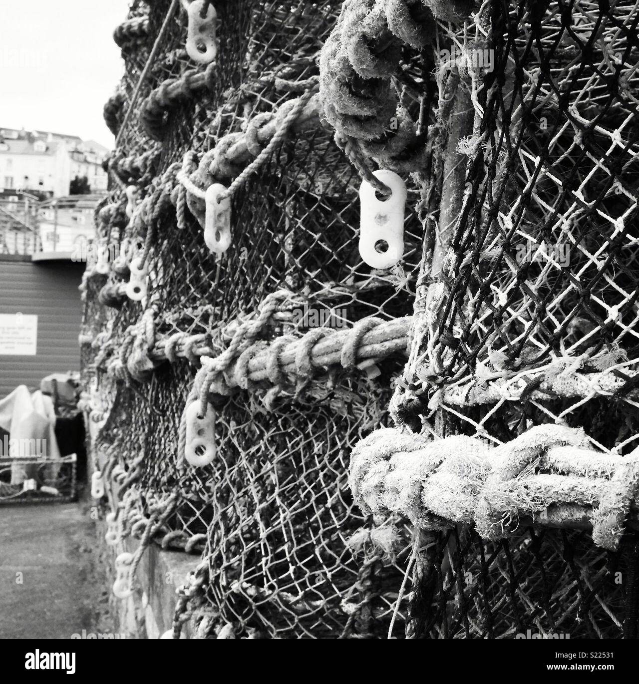 Fishing nets on a harbour Stock Photo - Alamy
