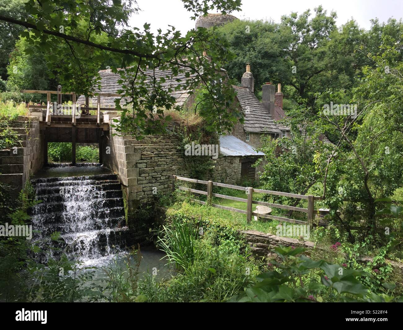 Forge village weir waterfall Stock Photo - Alamy