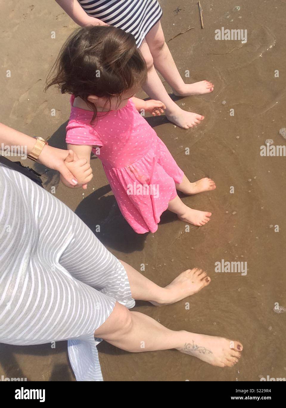 Feet in sea Stock Photo - Alamy