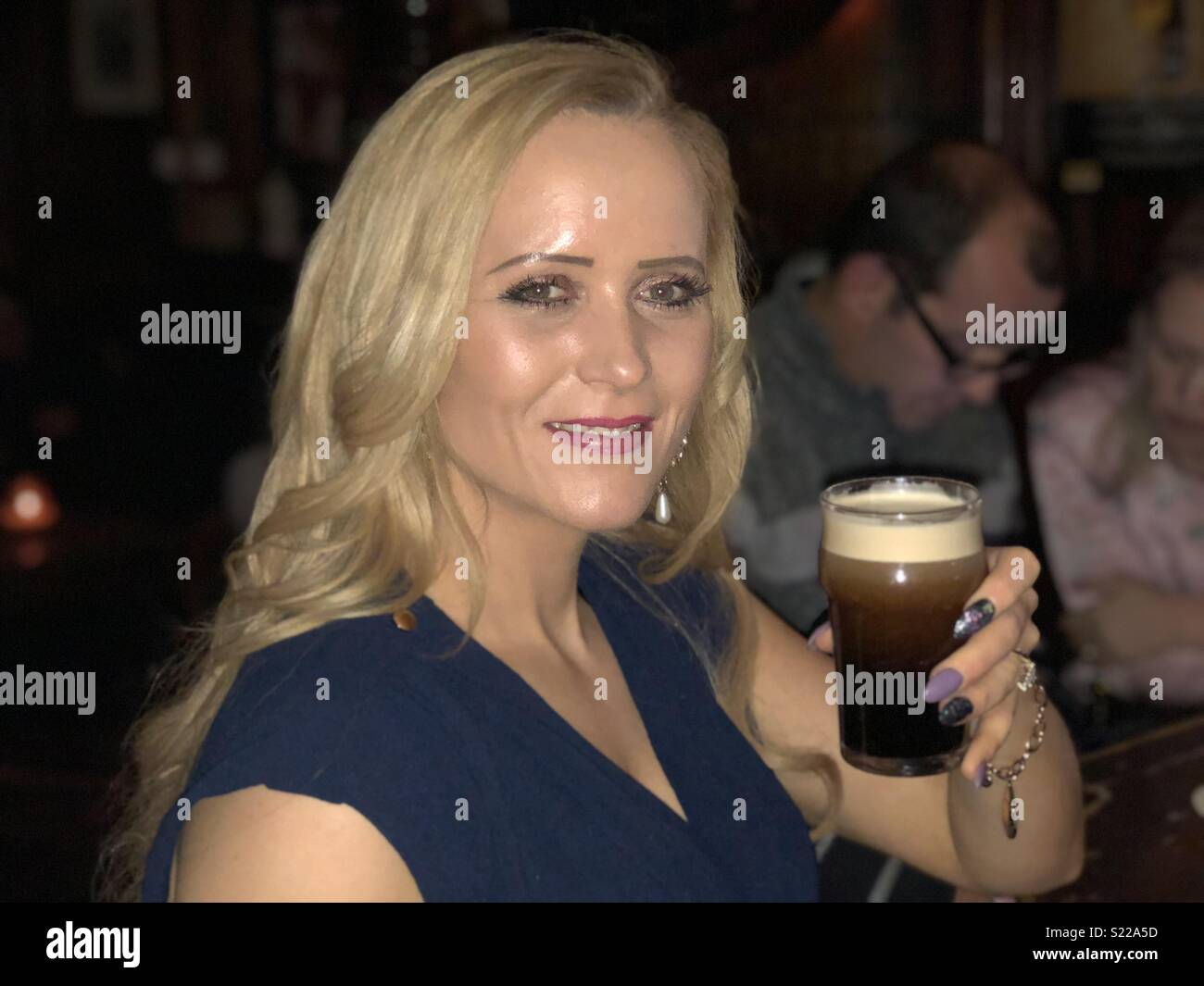 Woman guinness hi-res stock photography and images - Alamy