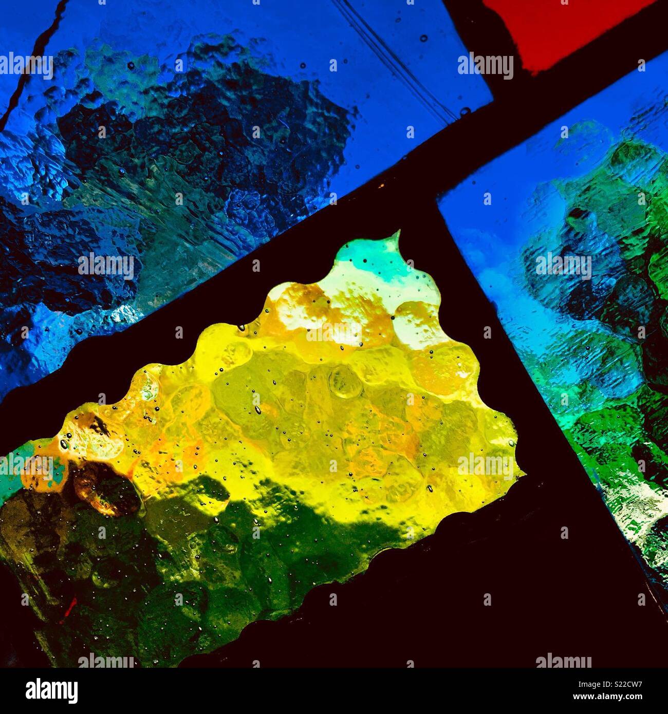 Stained glass with the sun shining through Stock Photo - Alamy