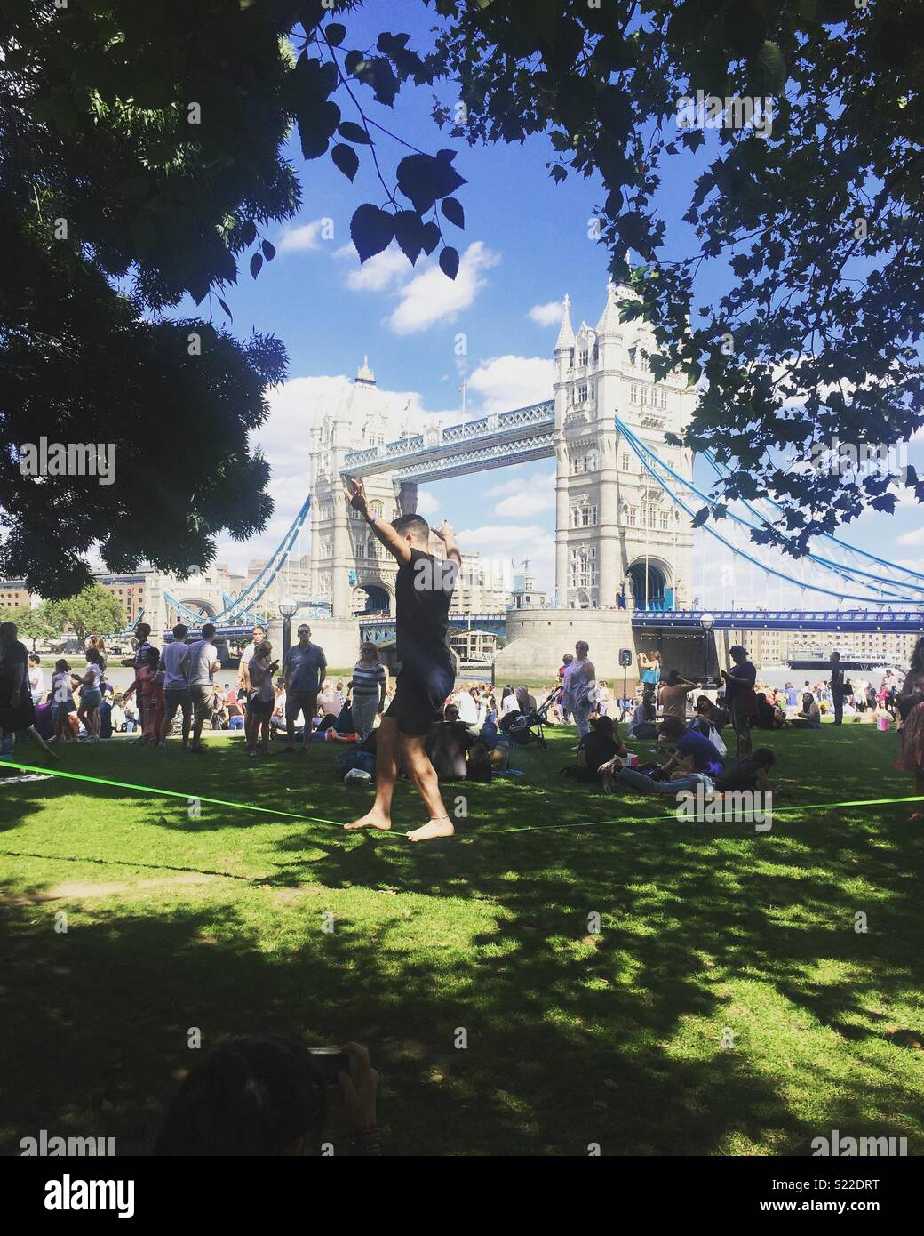 Tight rope walker, Tower Bridge, London Stock Photo - Alamy