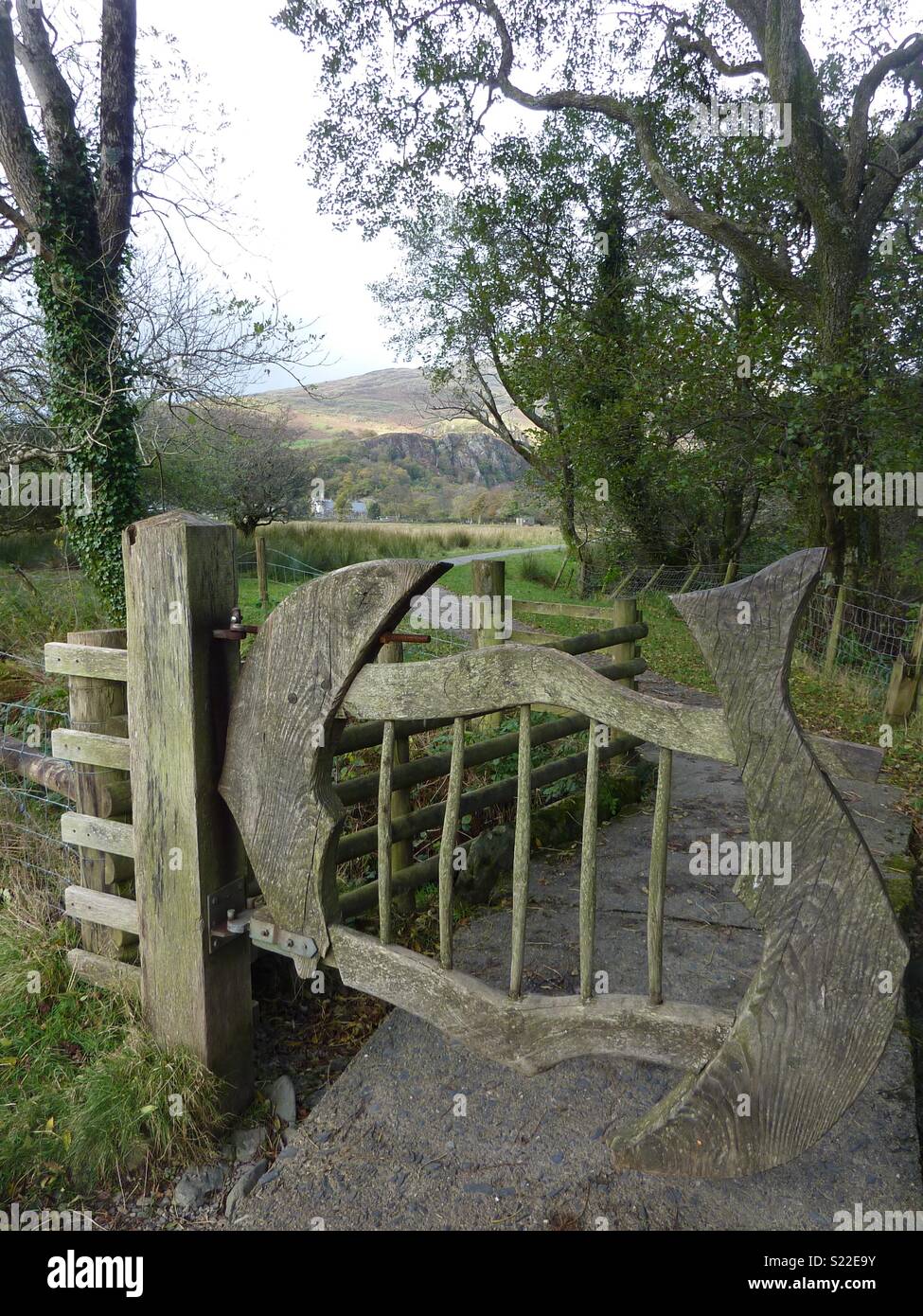 Rustic gate on path Stock Photo - Alamy