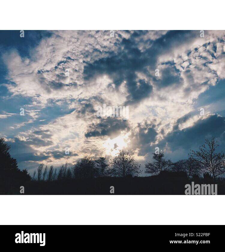 Sun peeking through the clouds hi-res stock photography and images - Alamy