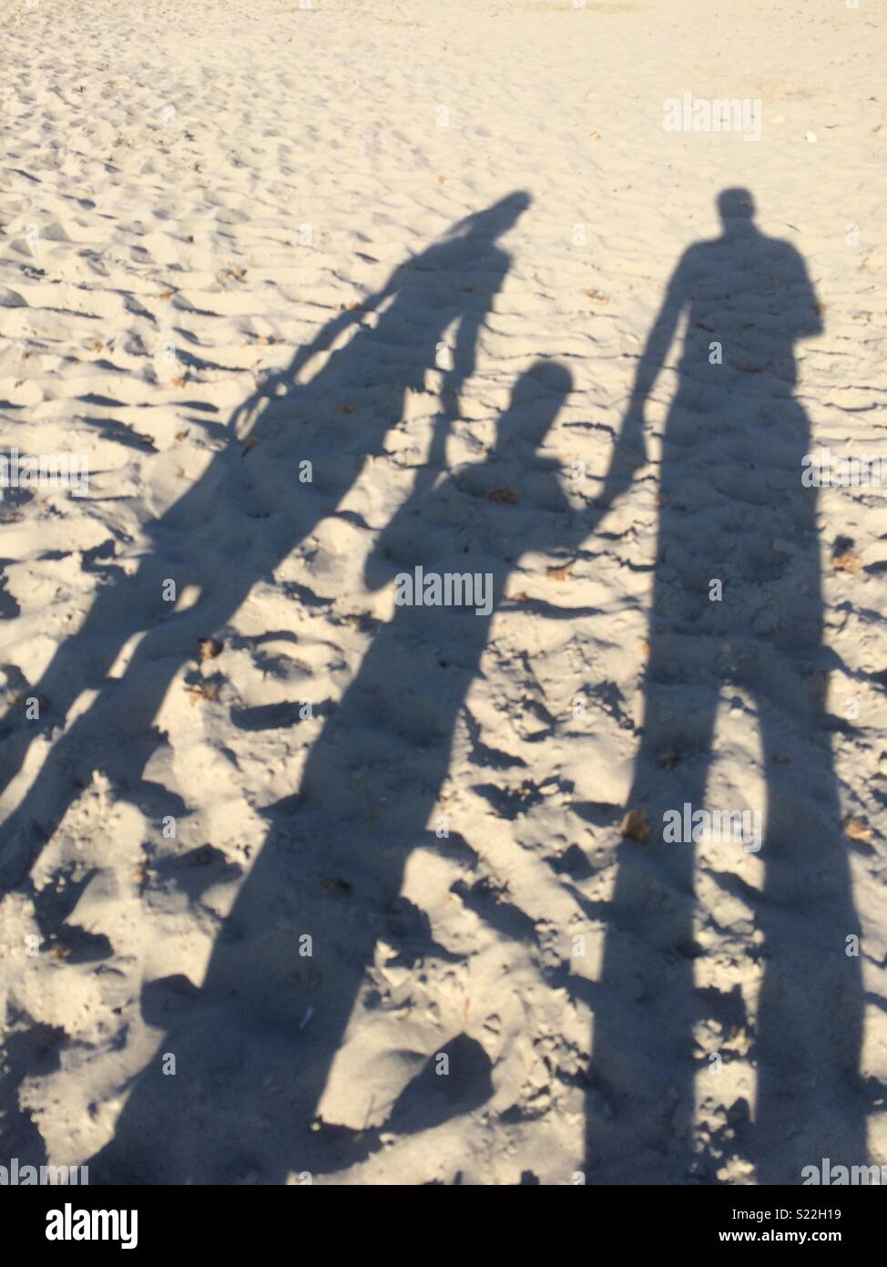 Shadow Of A Family With Two Teens