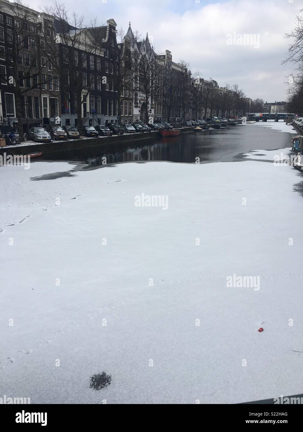 Snowy frozen canal Amsterdam Stock Photo - Alamy