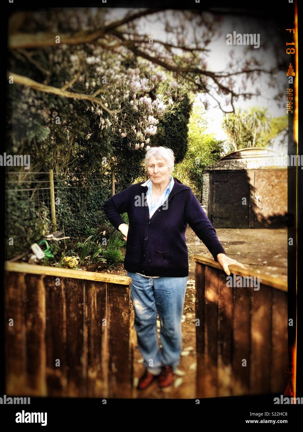 Elderly woman at garden gate hi-res stock photography and images - Alamy