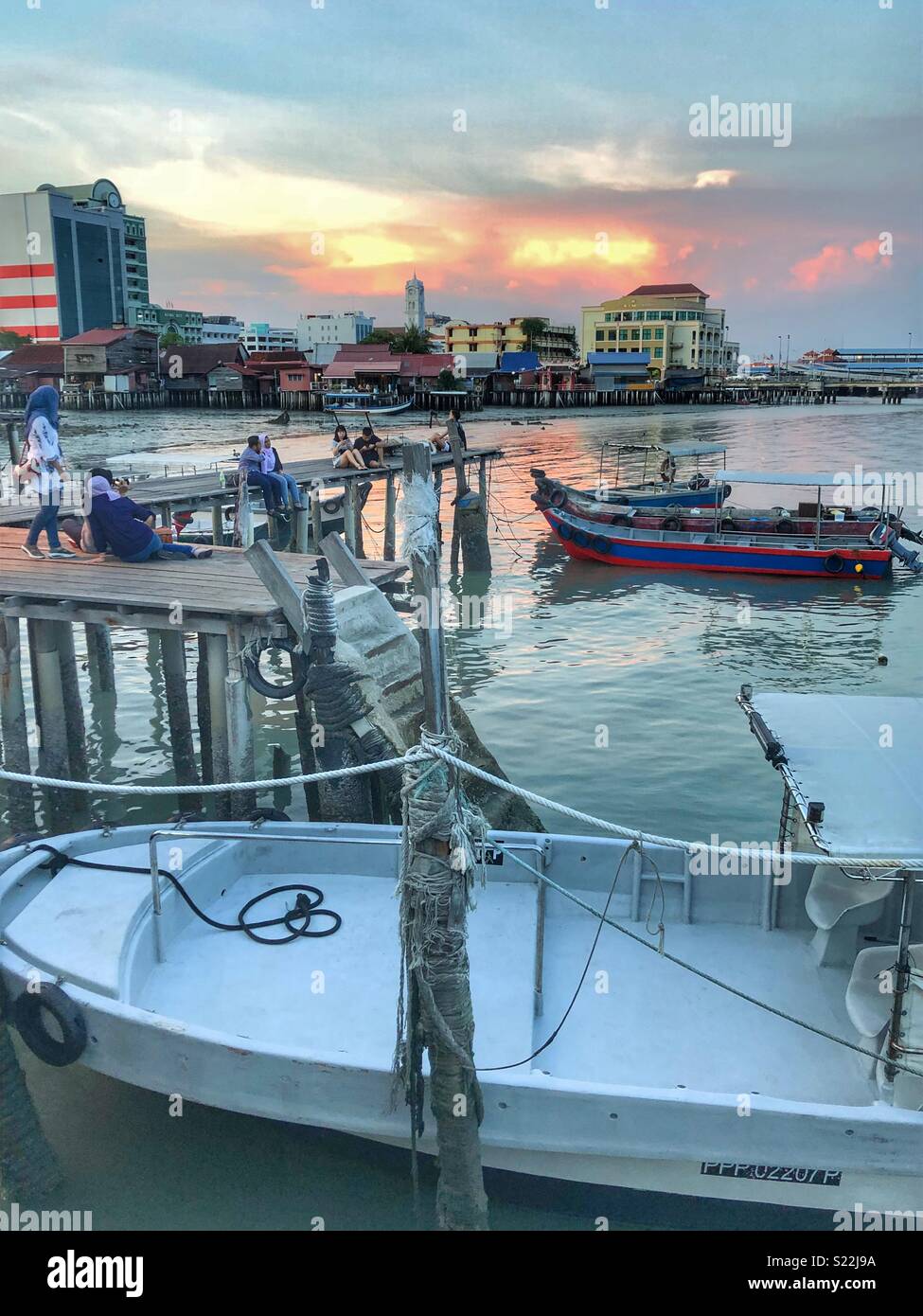 Enjoying the sunset from a pier in Penang, Malaysia Stock Photo - Alamy