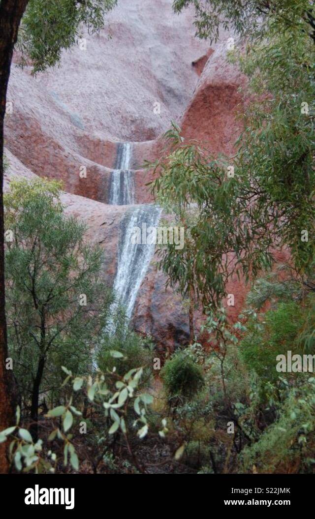 Waterfalls down Uluru Stock Photo - Alamy