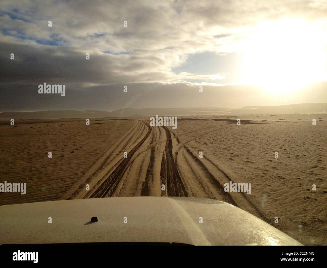 Car driving through desert road hi-res stock photography and images - Alamy
