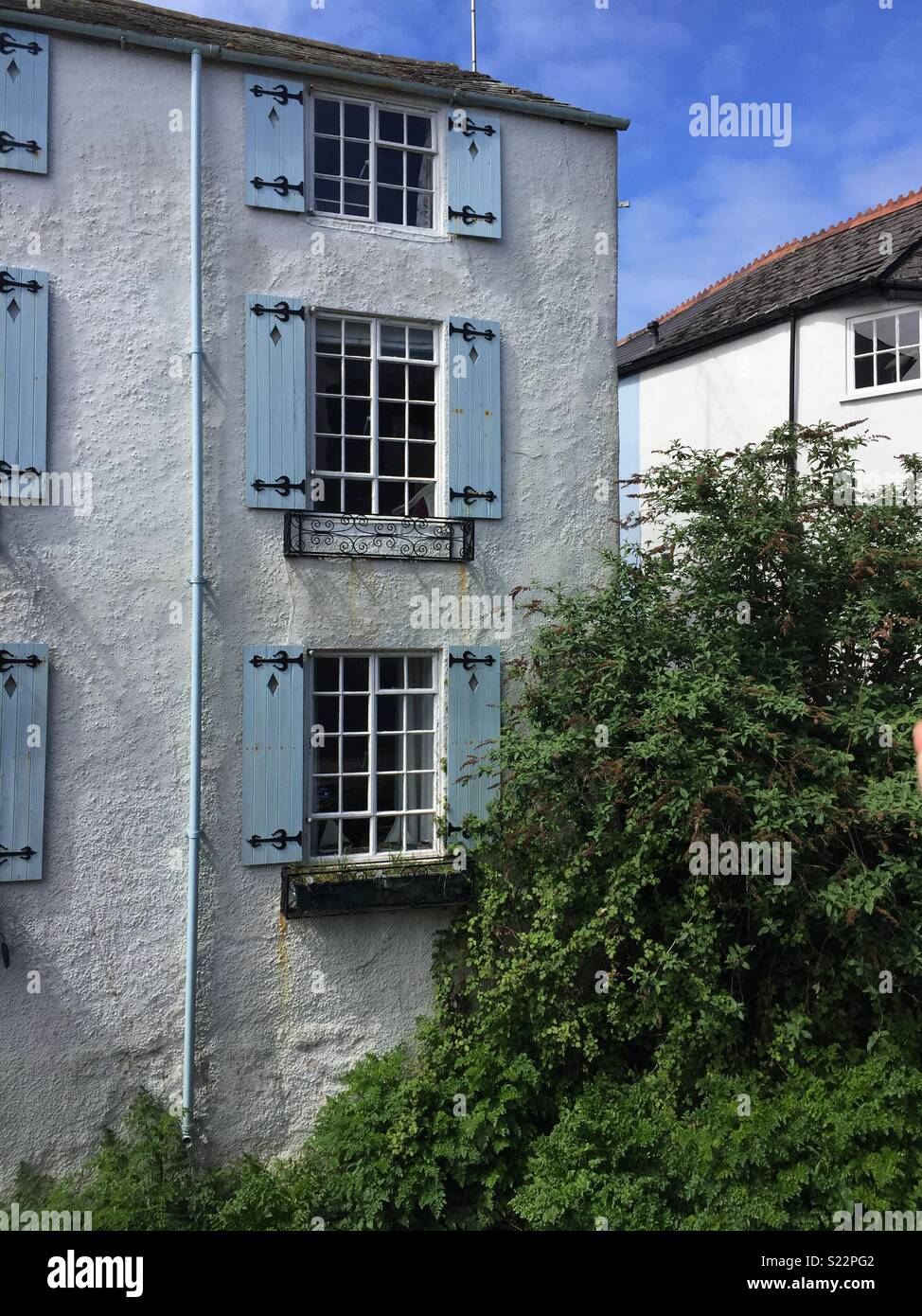 Pretty house shutters Stock Photo - Alamy