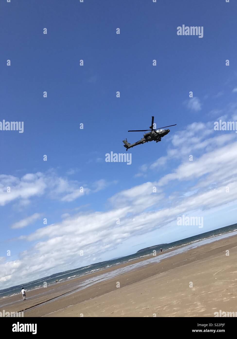 Helicopter over beach Stock Photo - Alamy