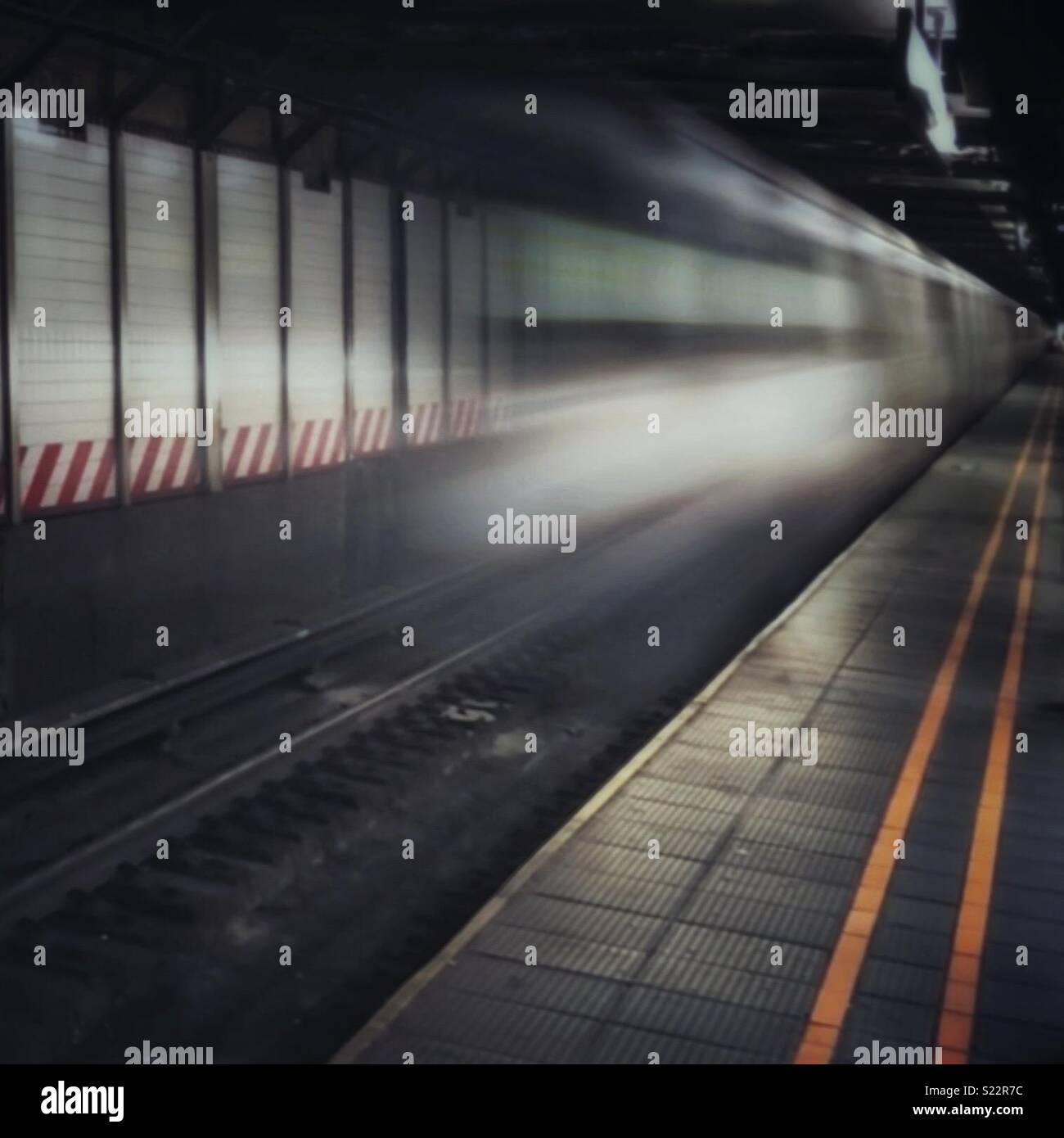 Disappearing New York Subway train Stock Photo - Alamy
