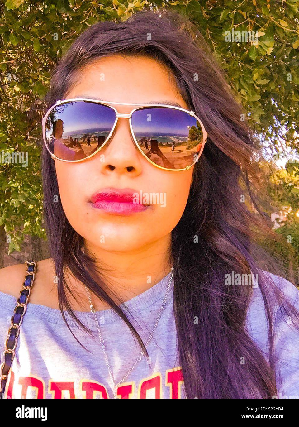 Girl with reflective sunglasses hi-res stock photography and images - Alamy