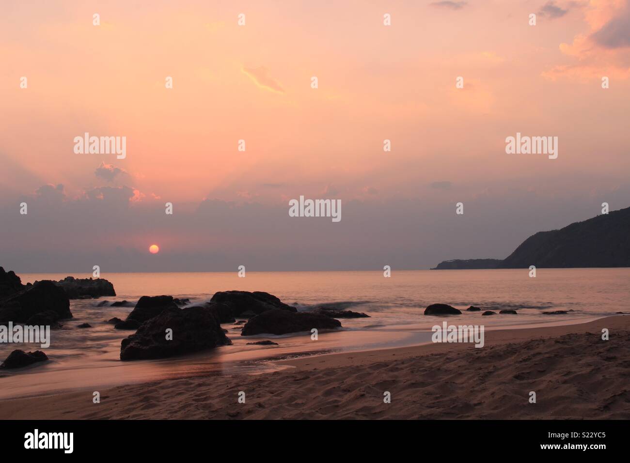 Beach sunset (slow shutter speed Stock Photo - Alamy
