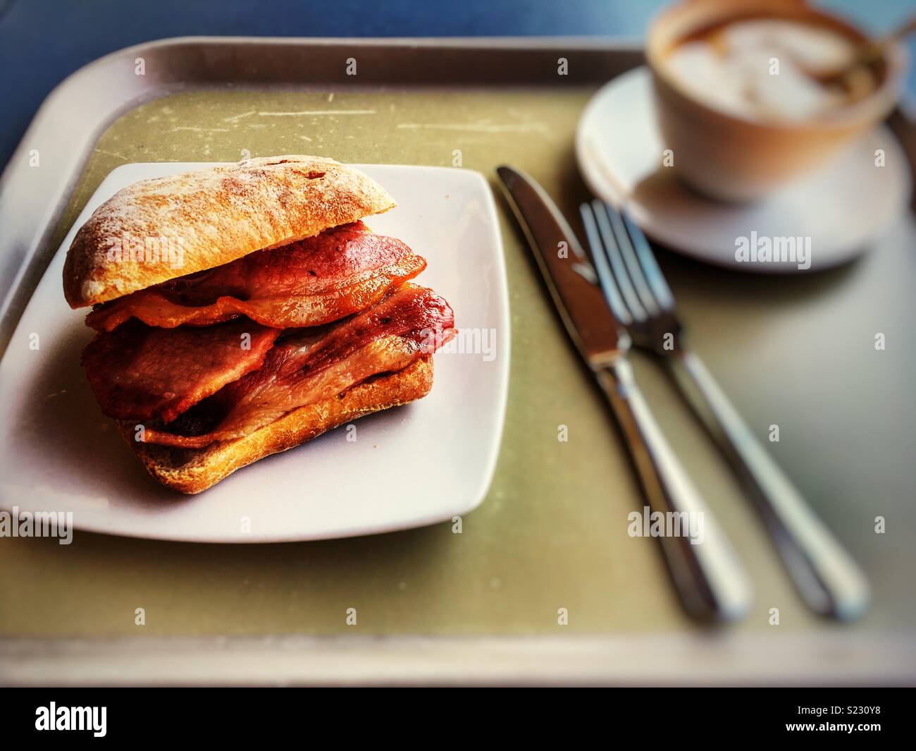 Waitrose Cafe bacon roll and cappuccino coffee Stock Photo - Alamy
