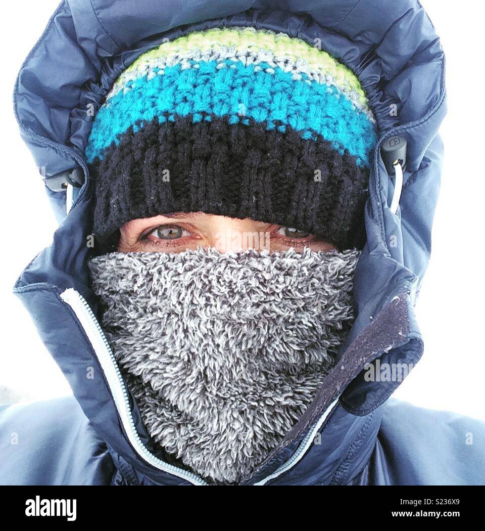Wrapped up against the elements hi-res stock photography and images - Alamy